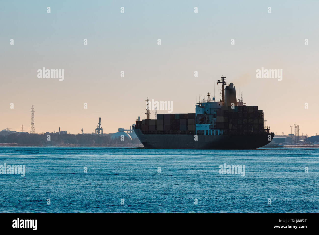 Modern black container ship moving from Baltic sea Stock Photo - Alamy