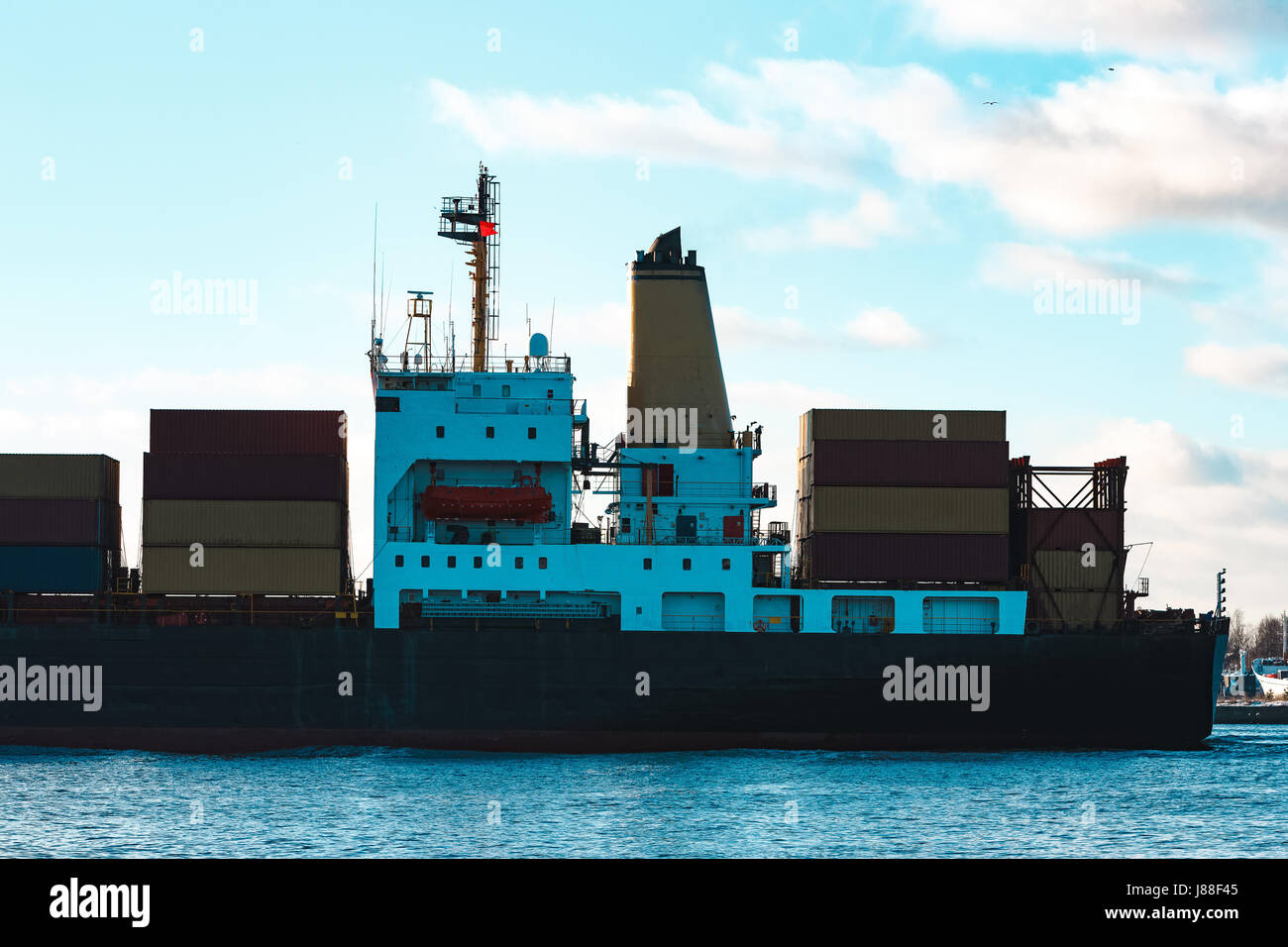 Modern black container ship moving from Baltic sea Stock Photo - Alamy