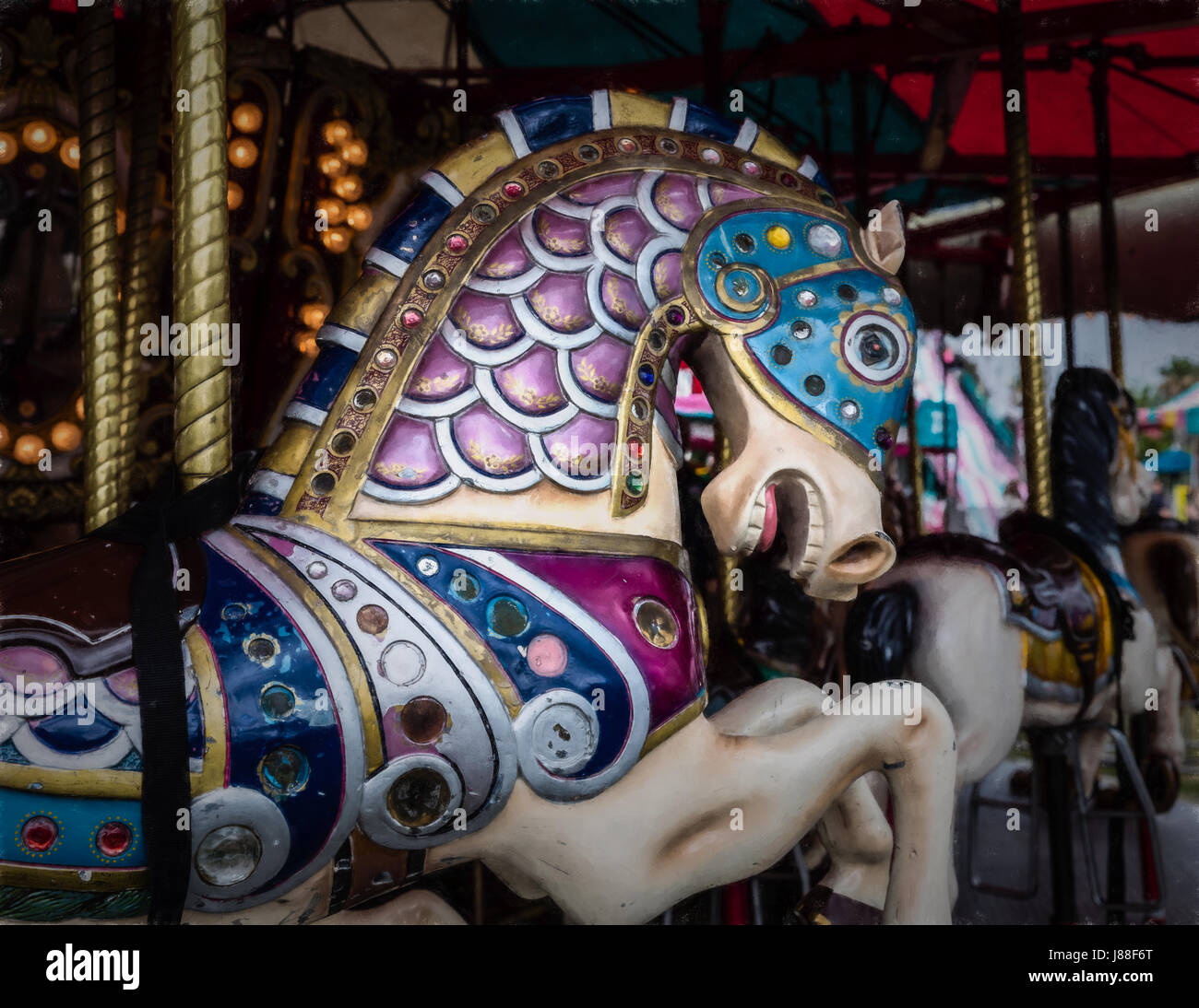 Merry go round animals at the county fair Stock Photo - Alamy