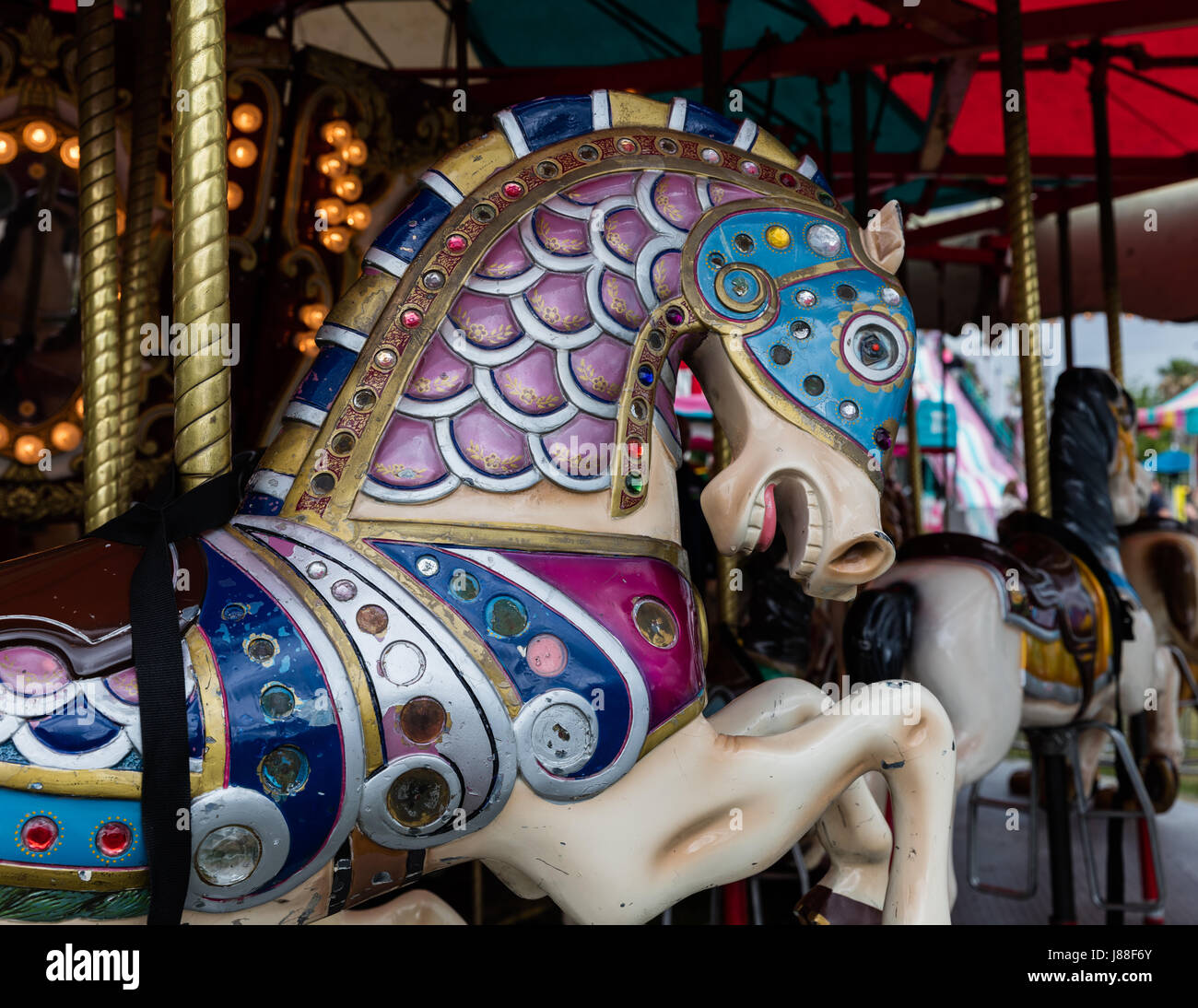 Merry go round animals at the county fair Stock Photo - Alamy