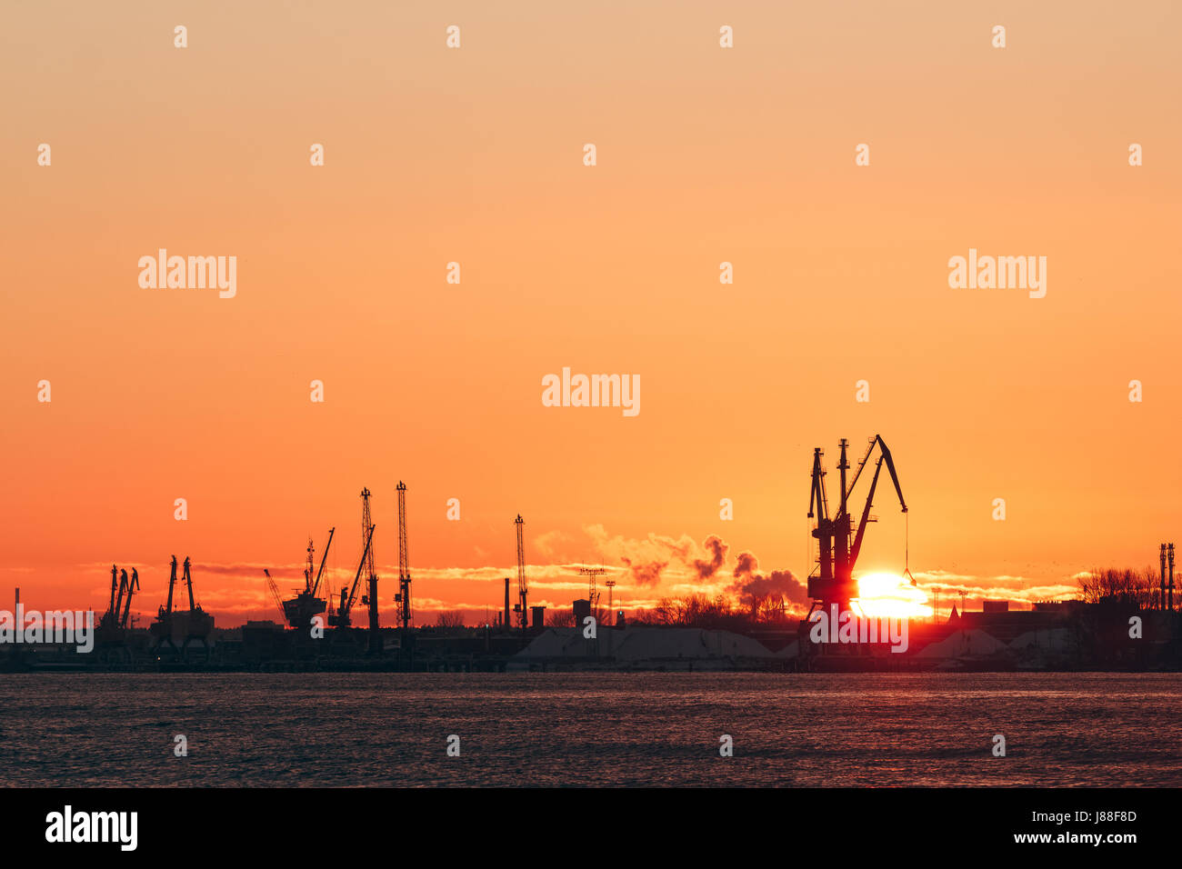 Hot winter sunrise over the cargo port in Riga Stock Photo - Alamy