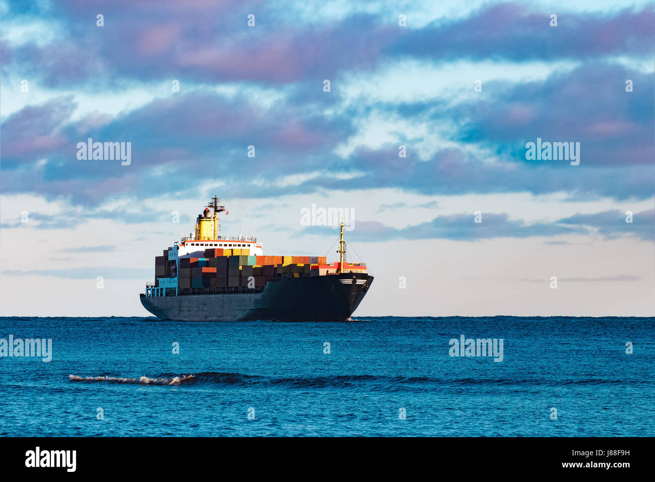Modern black container ship moving from Baltic sea Stock Photo - Alamy