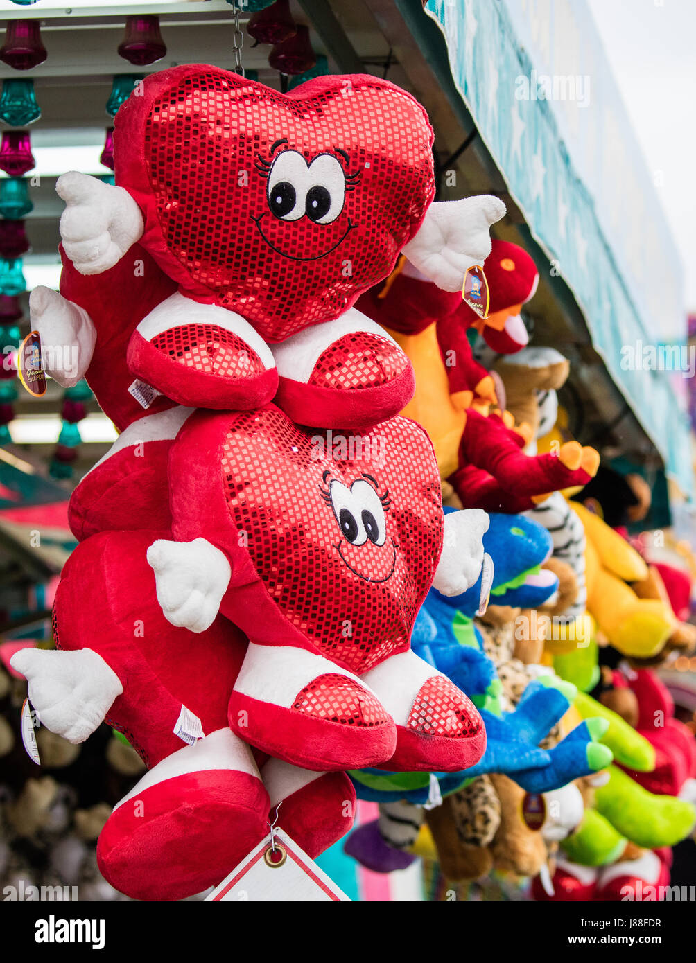 Stuffed animal toy prizes at the county fair Stock Photo - Alamy