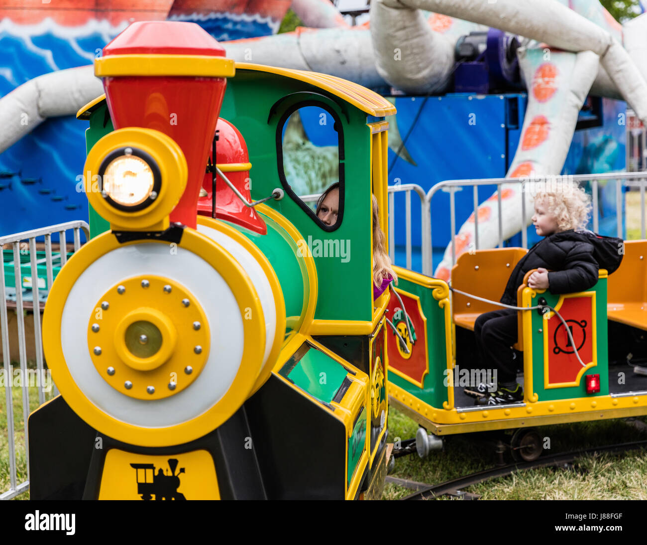 Fairgoers enjoying the rides at a county fair Stock Photo - Alamy
