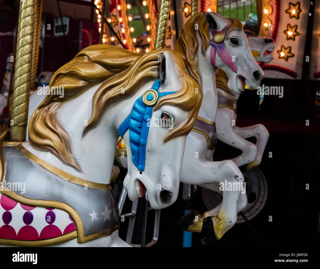 Merry go round animals at the county fair Stock Photo - Alamy