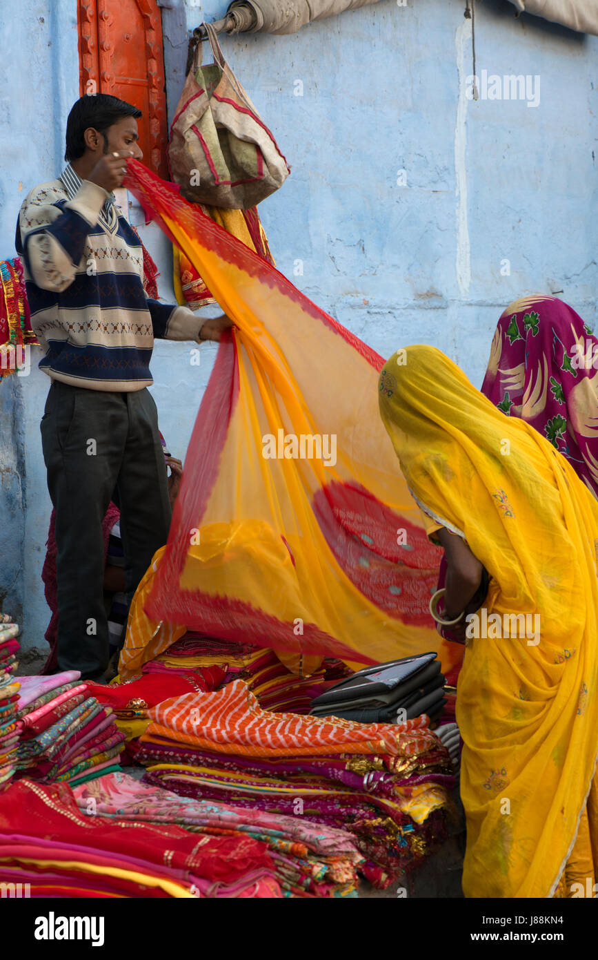 A woman shops for drapery at a market stall in Jodhpur, Rajasthan ...