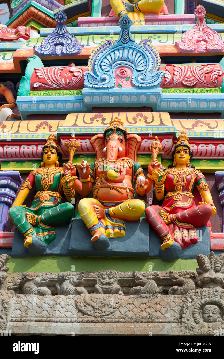The Hindu deity Ganesh is depicted on the facade of a Hindu temple in ...