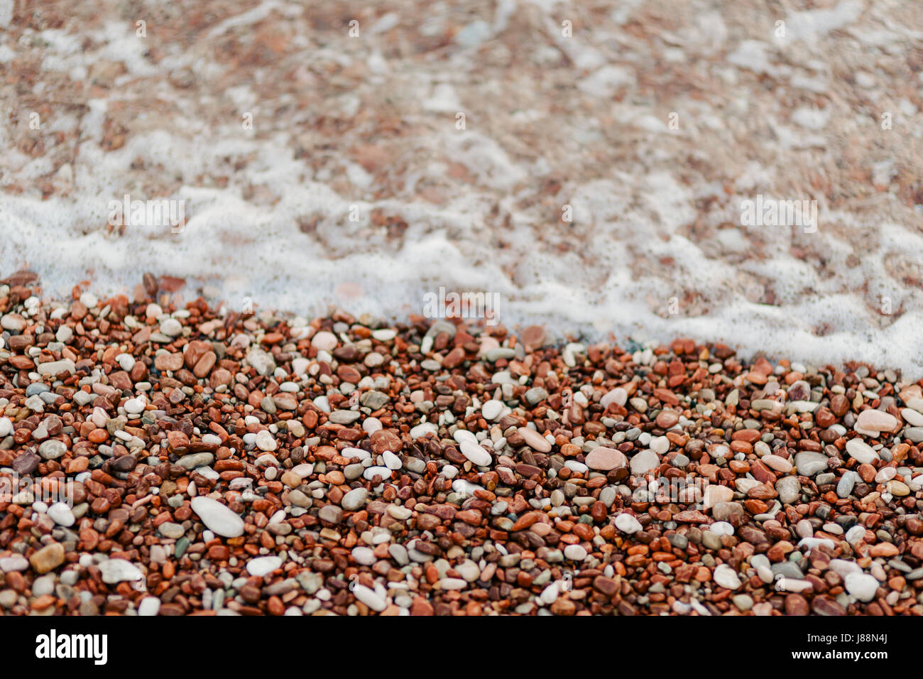 Pebbles on the beach. Texture of the sea shore. The Adriatic Sea in ...