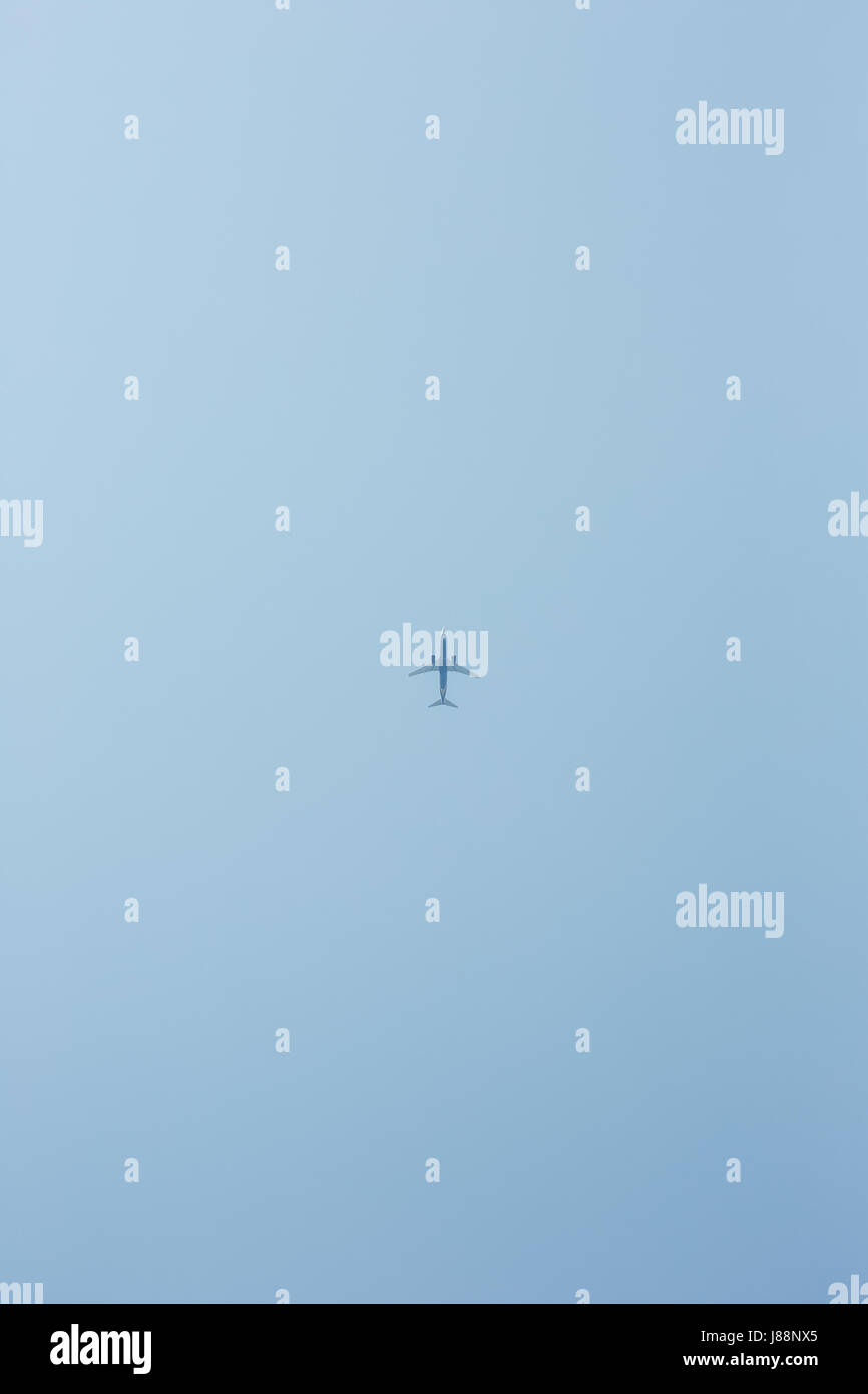 Plane in the sky. Shooted from the ground Stock Photo - Alamy