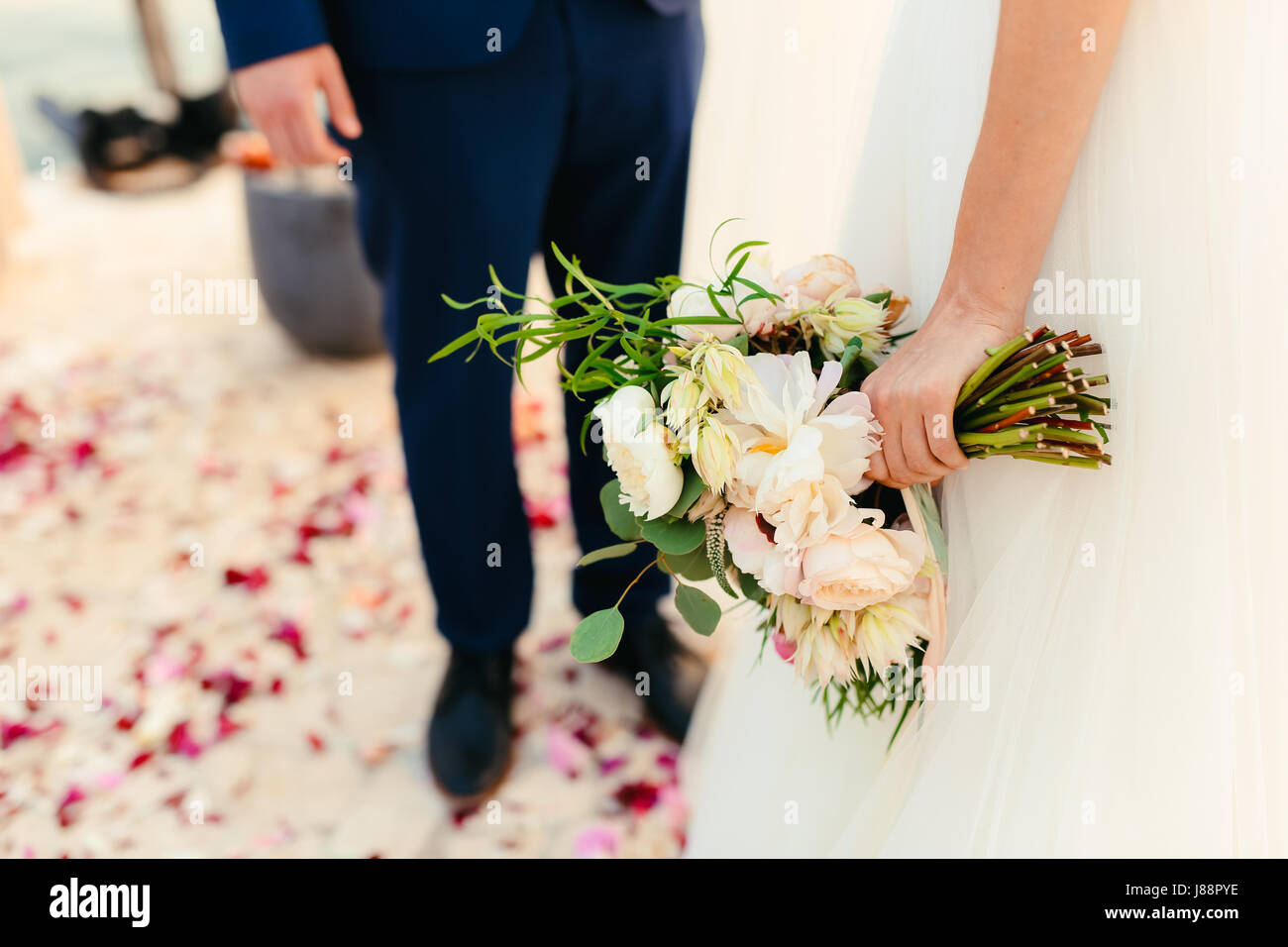 Wedding bouquet of peonies in the hands of the bride. Wedding in ...
