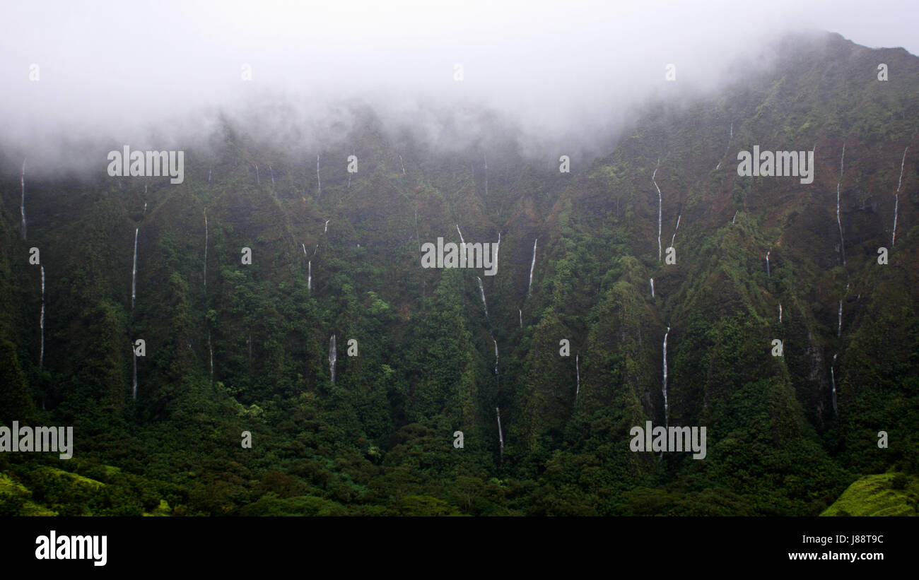 Waterfalls at Koolau mountain range on a rainy day, Kaneohe, Oahu ...