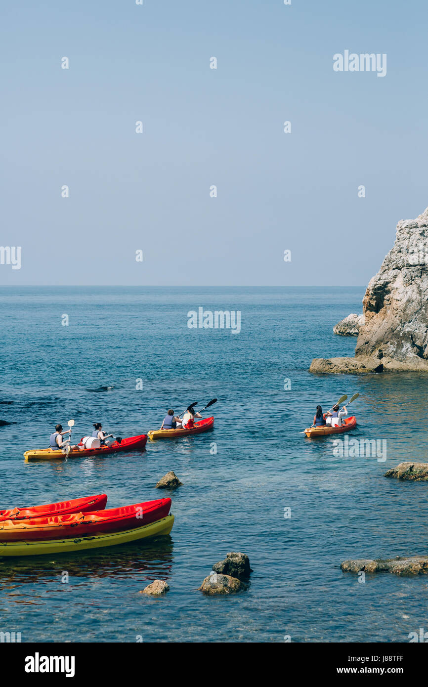 Kayaks at sea. Tourist kayaking in the sea near Dubrovnik, Croatia ...