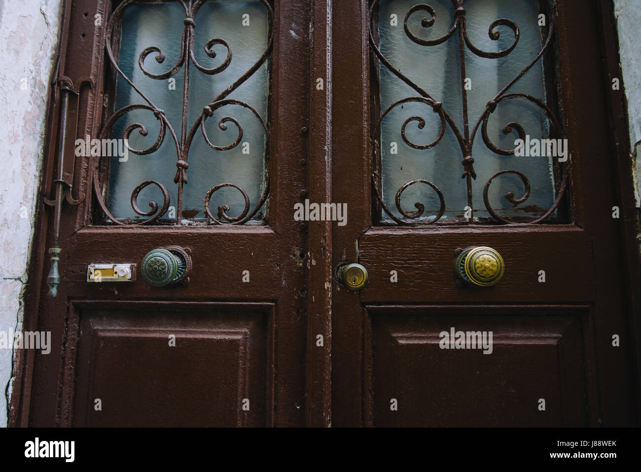 Old yellow, brown, red doors. Wood texture. Old shabby irradiated paint ...