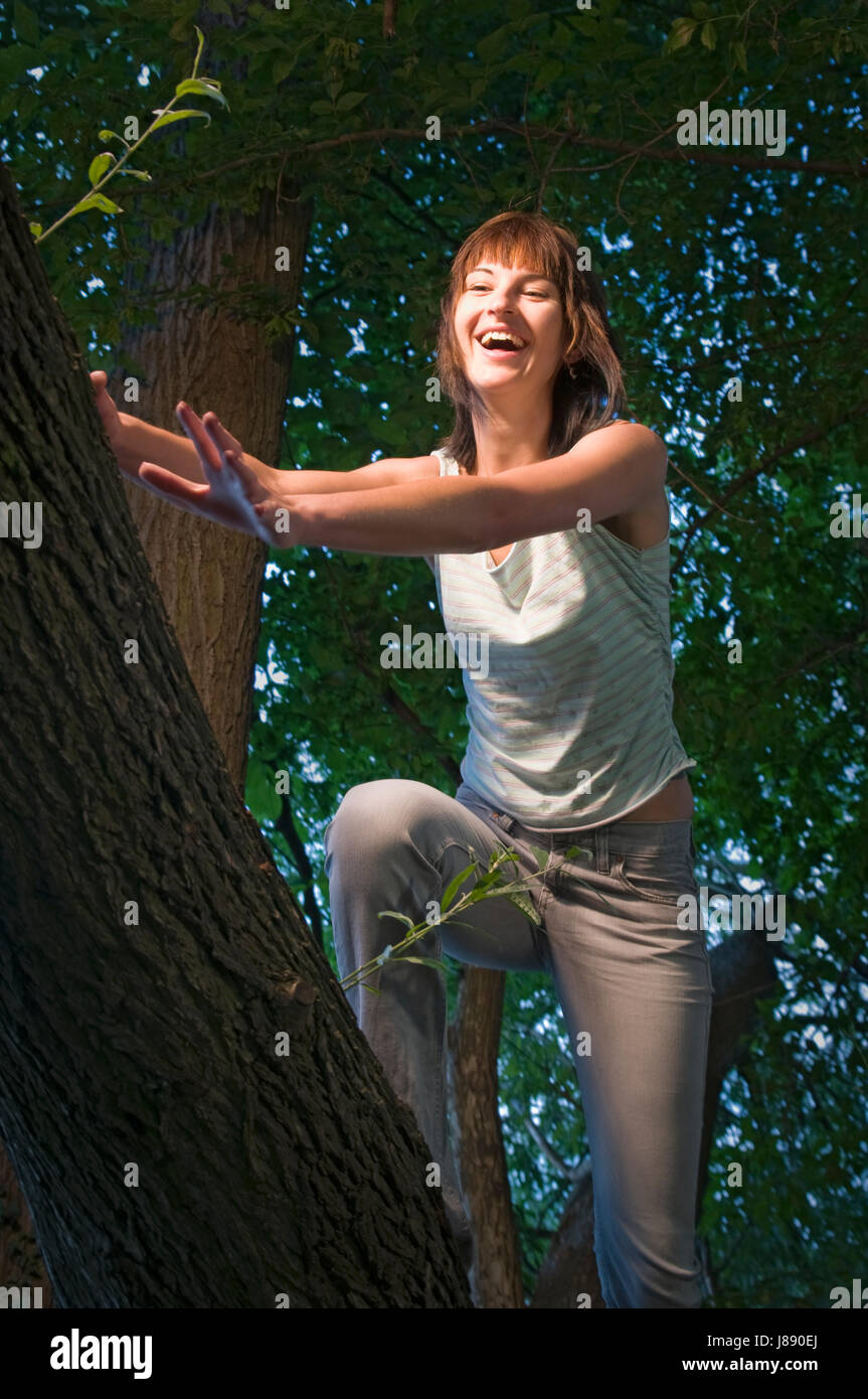 young lady falling on the tree Stock Photo - Alamy