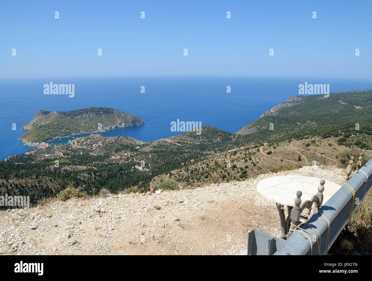 Chairs and table on the road to Assos village with panoramic view of ...