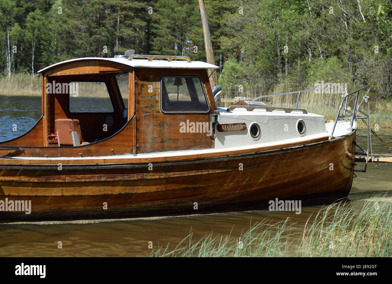 A stranded boat in a bay Stock Photo - Alamy