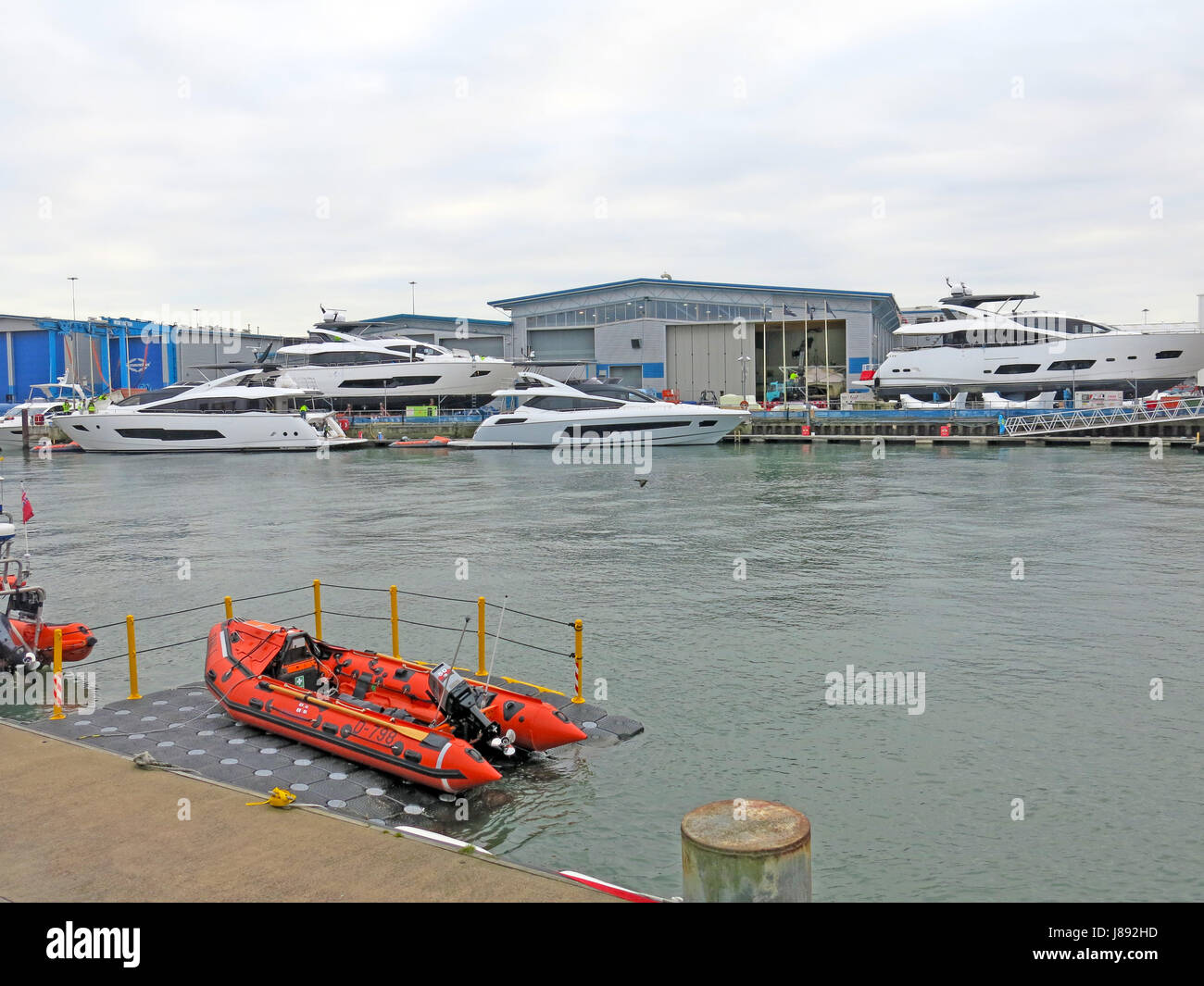 Expensive luxury yachts in various designs, sizes and stages of ...