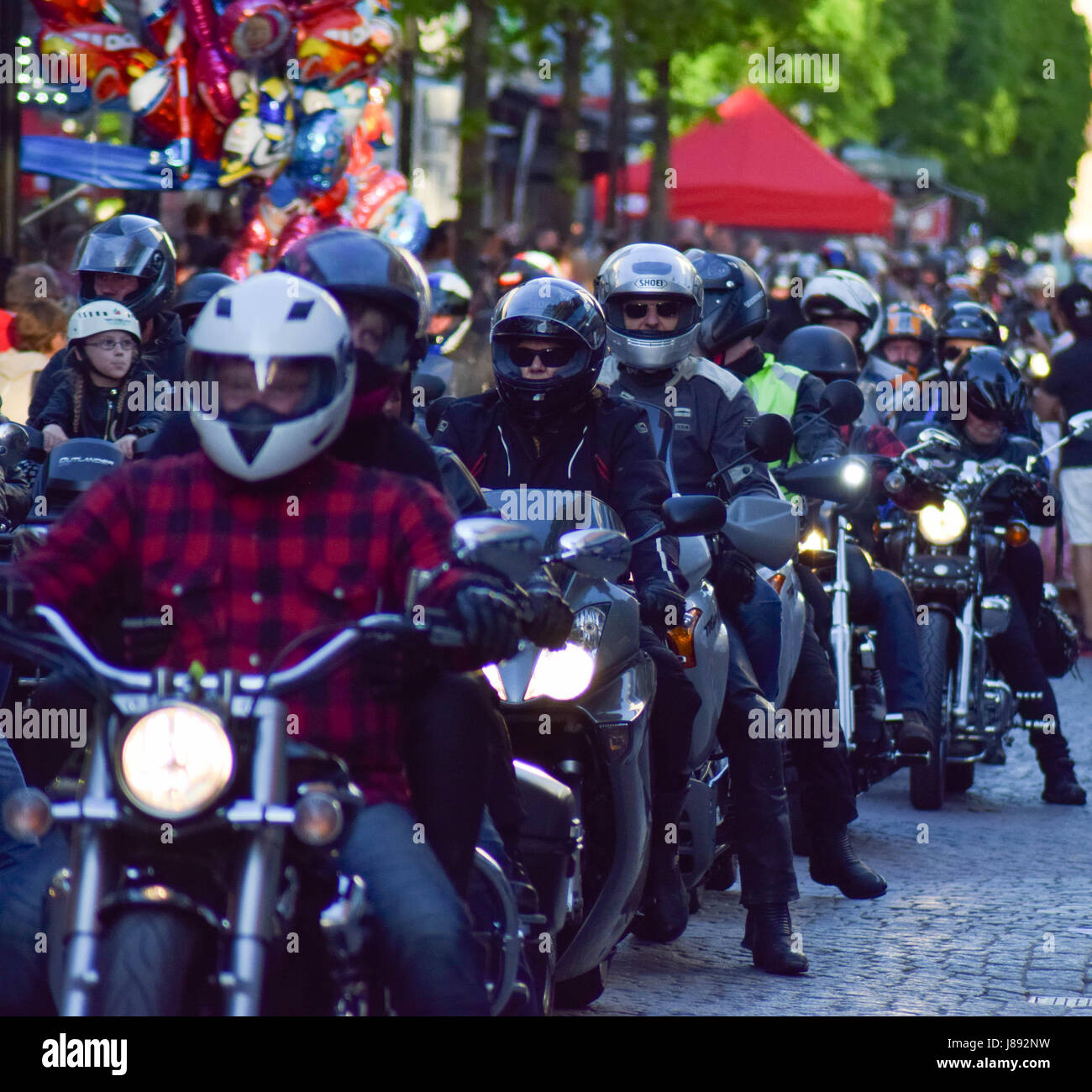 A motorcycle parade through the streets Stock Photo - Alamy
