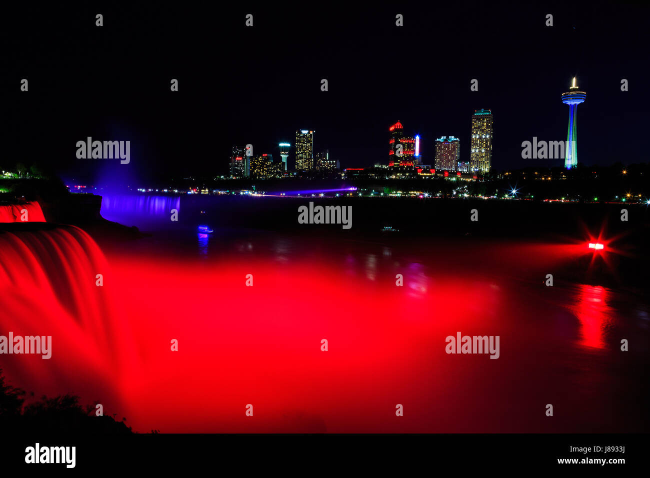 Niagara Falls on the American side illuminated with blue, green, red ...