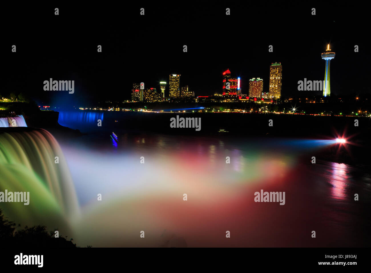 Niagara Falls on the American side illuminated with blue, green, red ...
