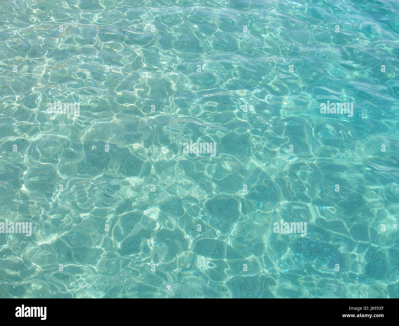 reflections in the crystal clear sea Stock Photo - Alamy