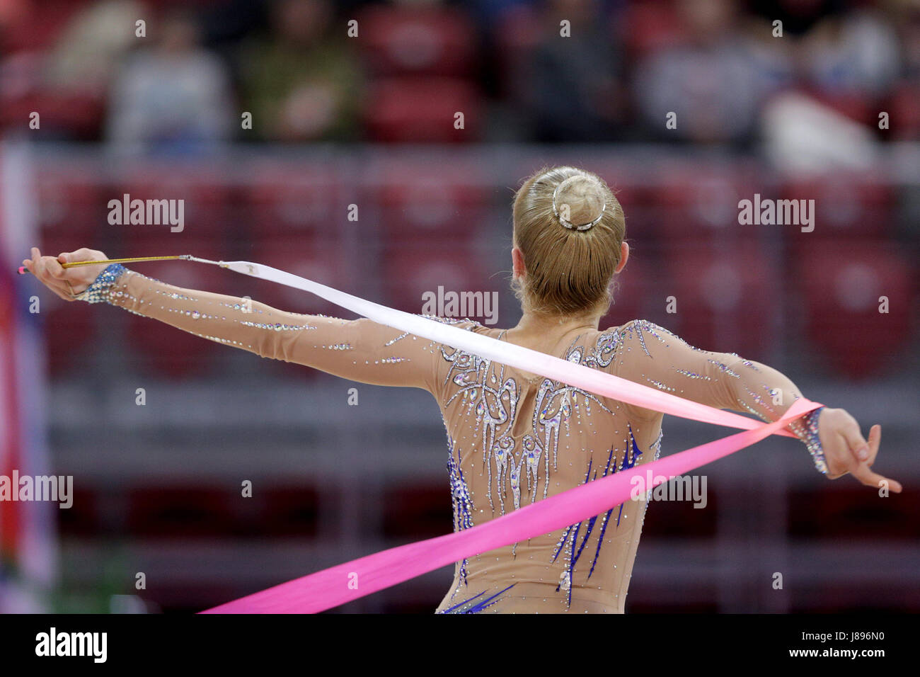 Individual Rhythmic gymnastics athlete performs with ribbon on the ...