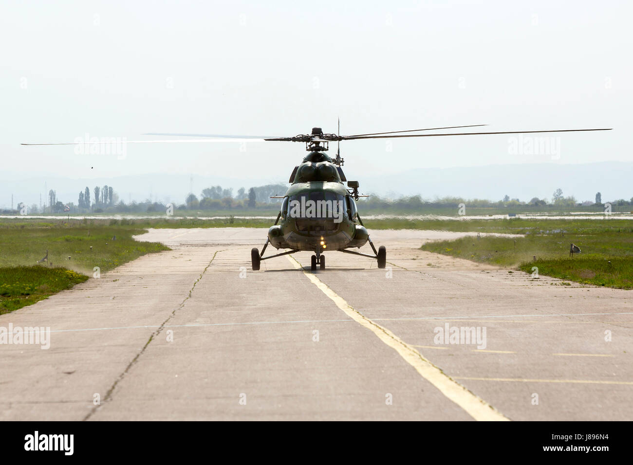 Military helicopter at the runway of the airport Stock Photo - Alamy