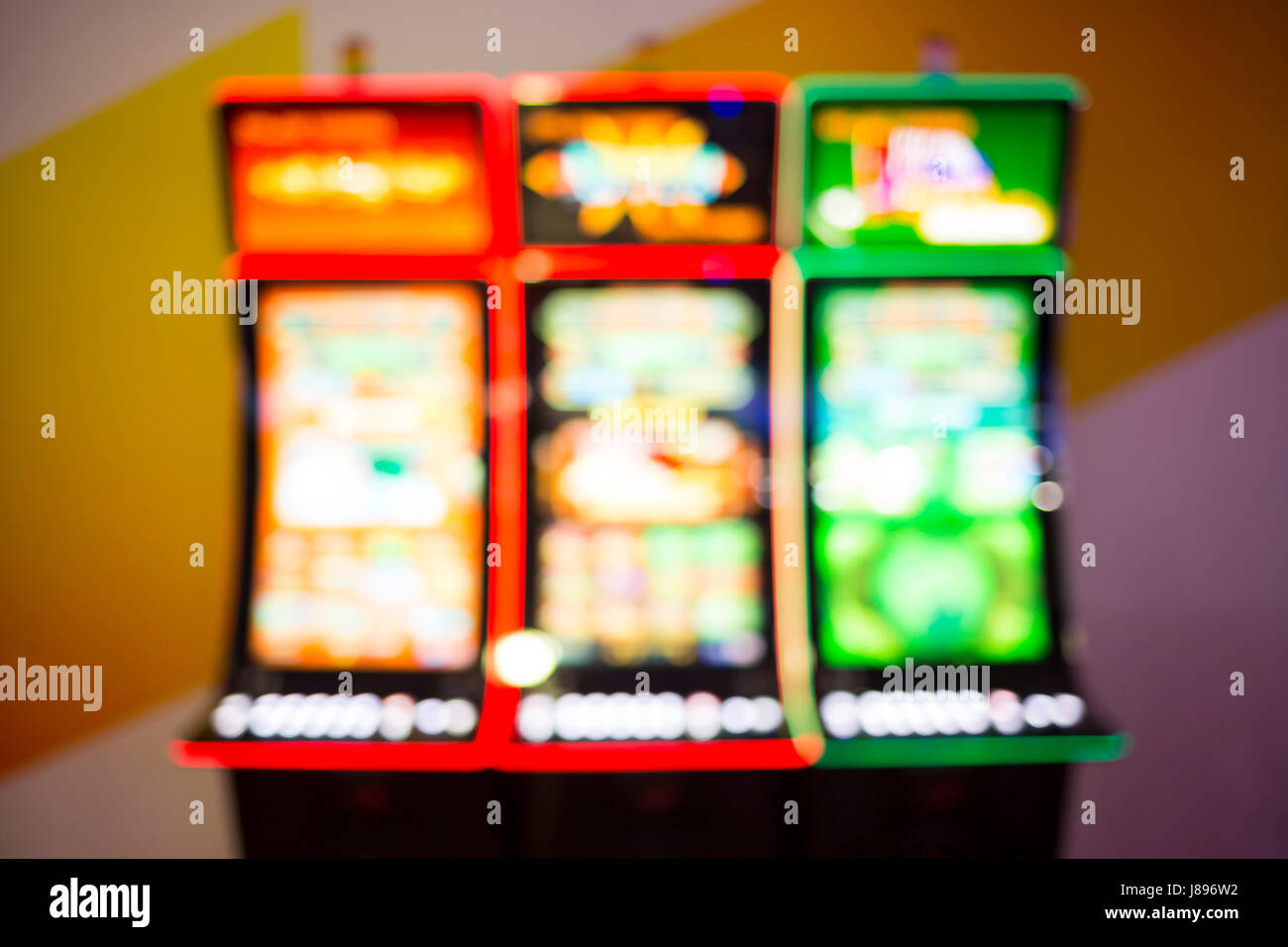 Blurred slot machines are seen in a casino. Out of focus blurry image ...