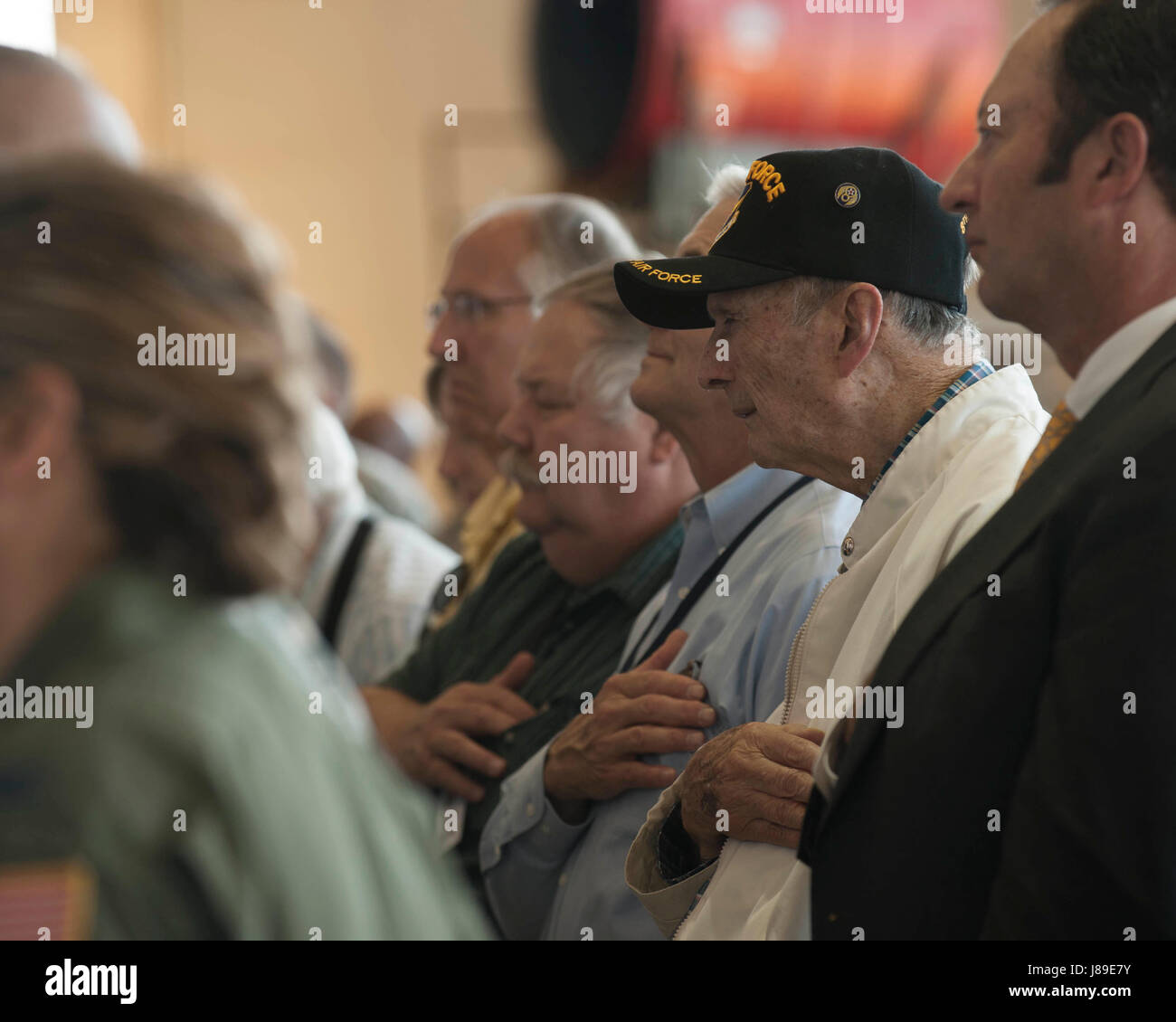 Former 489th Bombardment Group members place their hands over their ...