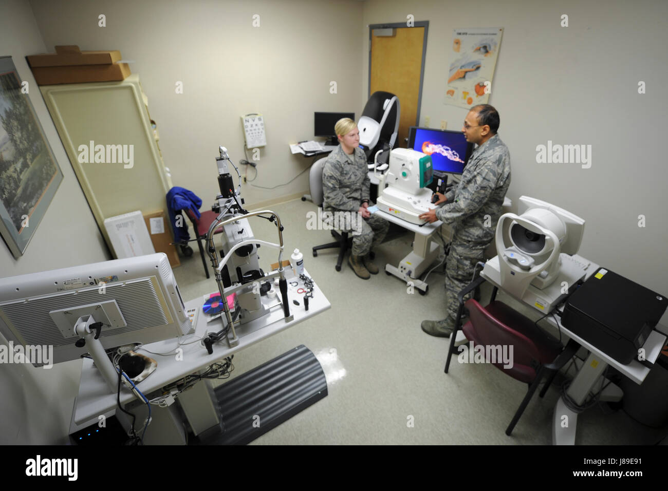 A patient, left, and Airman 1st Class Pratick Bhatt, an optometry ...