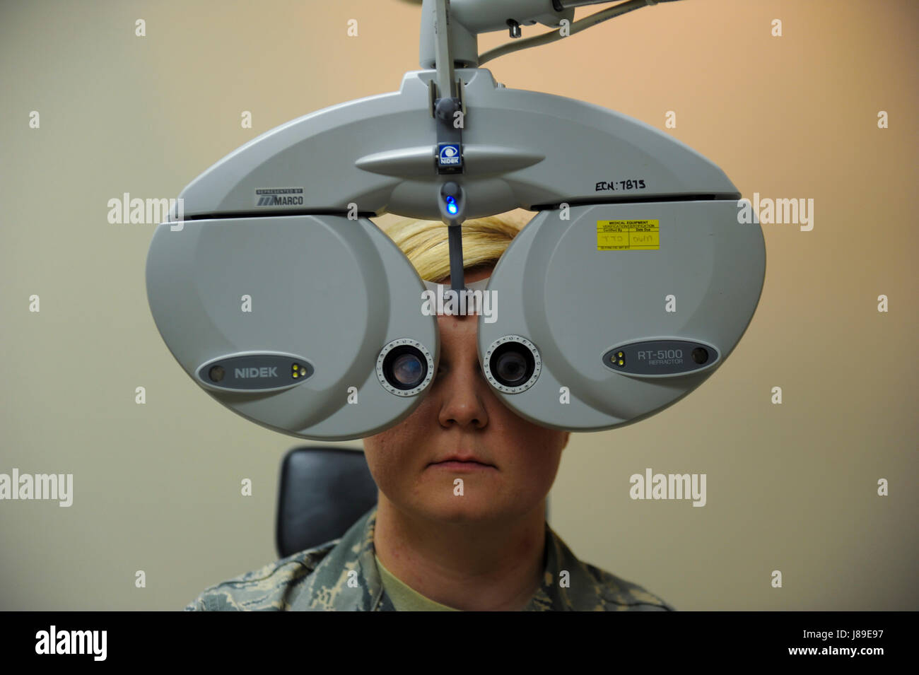 A patient looks through a phoropter at Hurlburt Field, Fla., Jan. 9 ...
