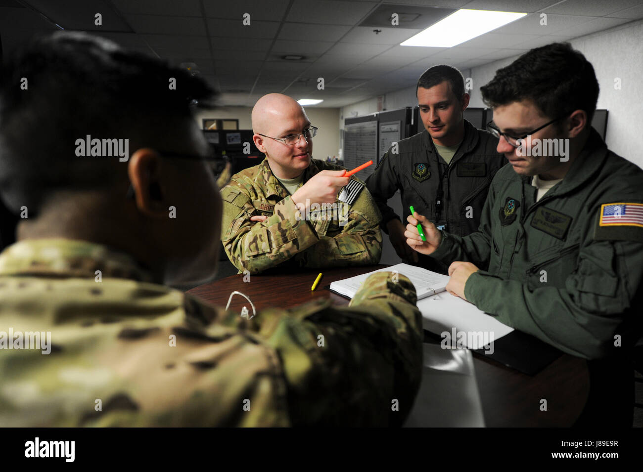 Members of the 25th Intelligence Squadron perform various tasks at ...