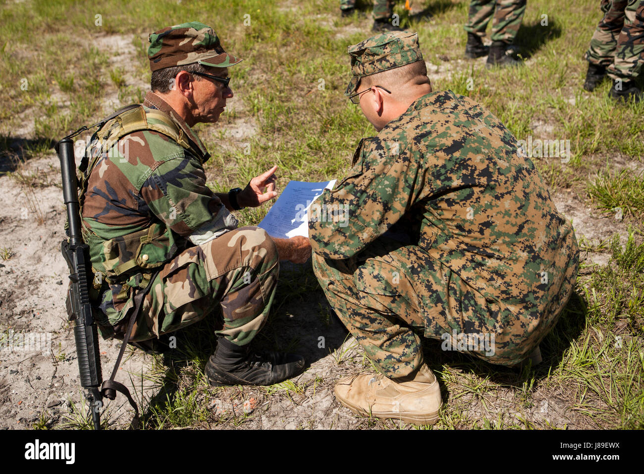 Sgt. Ethan J. Wright teaches marksmanship to a role player during ...