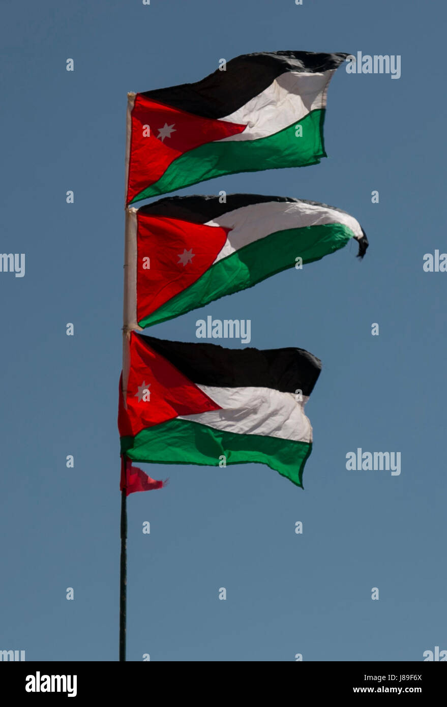 Jordanian flags atop a Jordan Armed Forces tank wave before the start ...