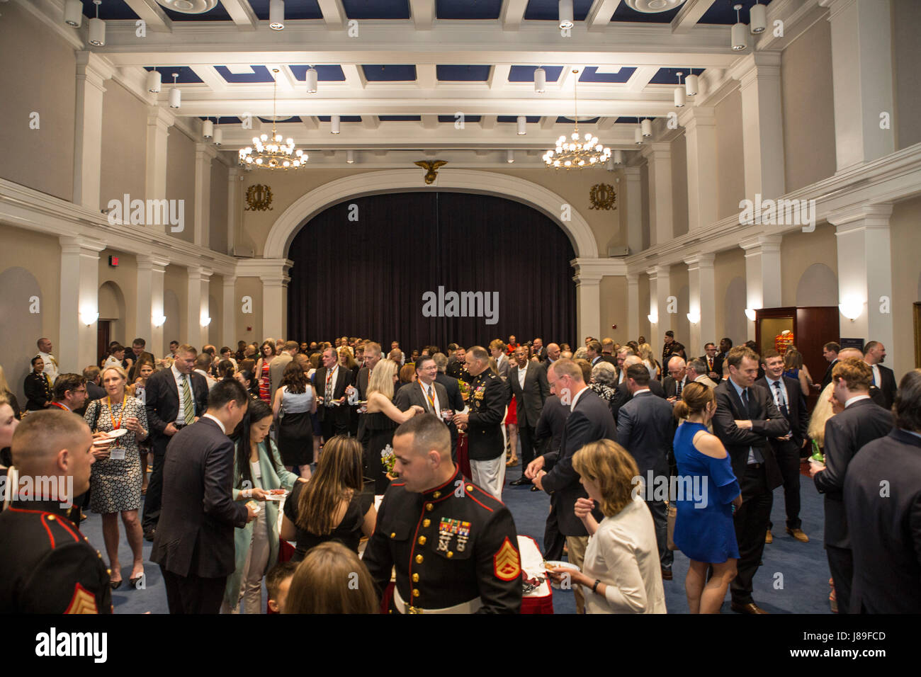 Guests attends a reception before an evening parade at Marine Barracks ...