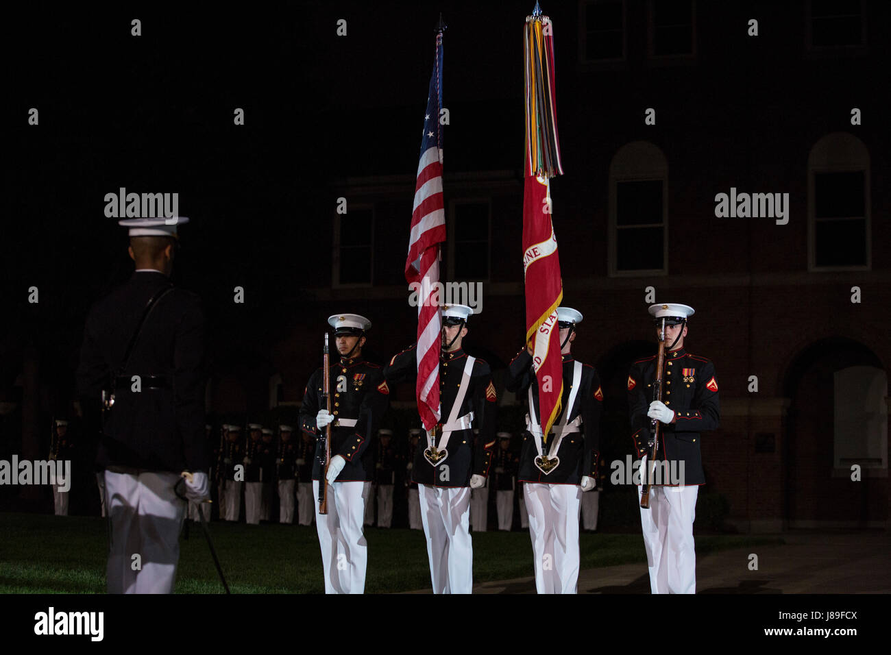 U.S. Marines with the official Marine Corps Color Guard present colors ...