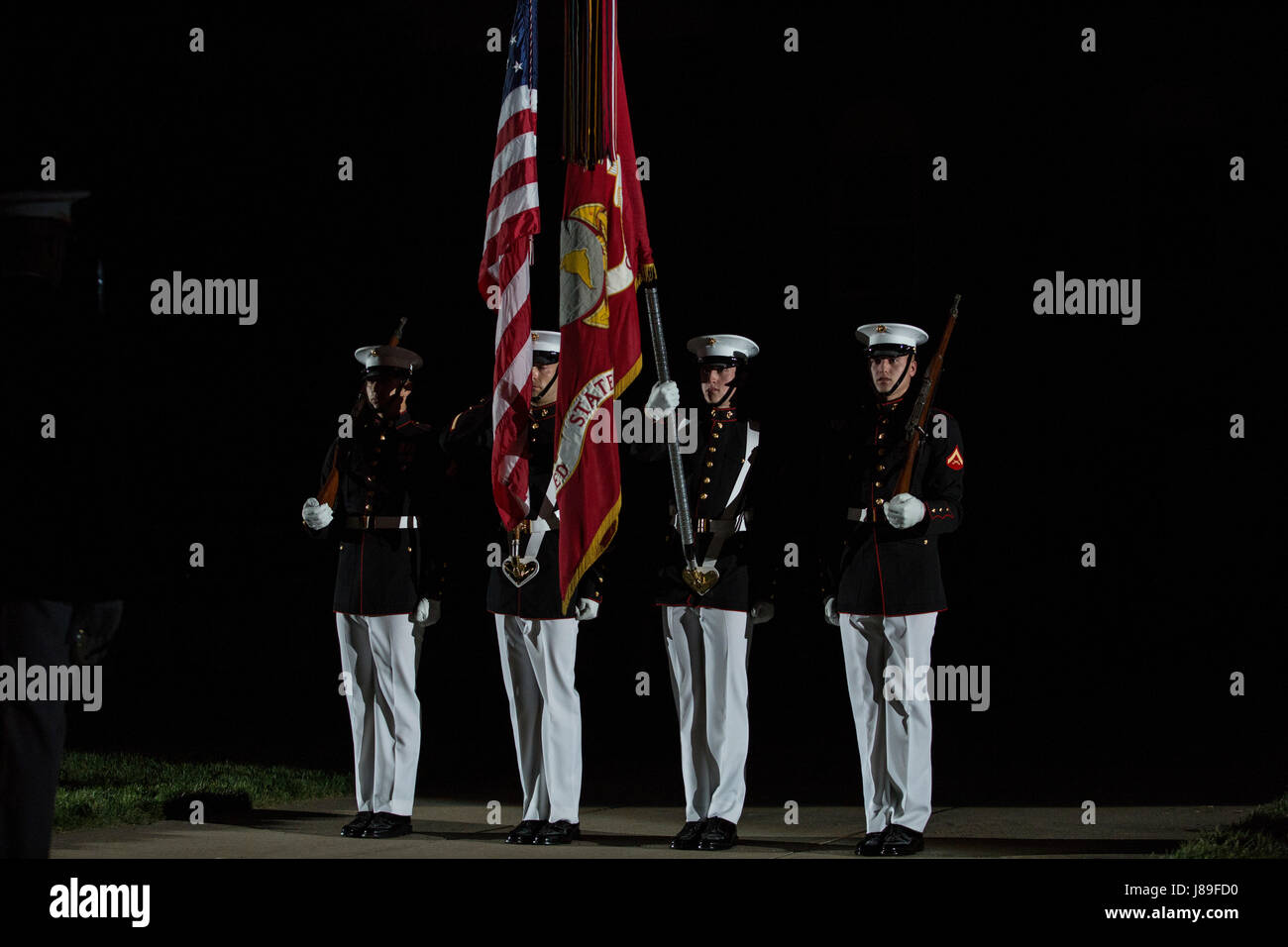 U.S. Marines with the official Marine Corps Color Guard present colors ...