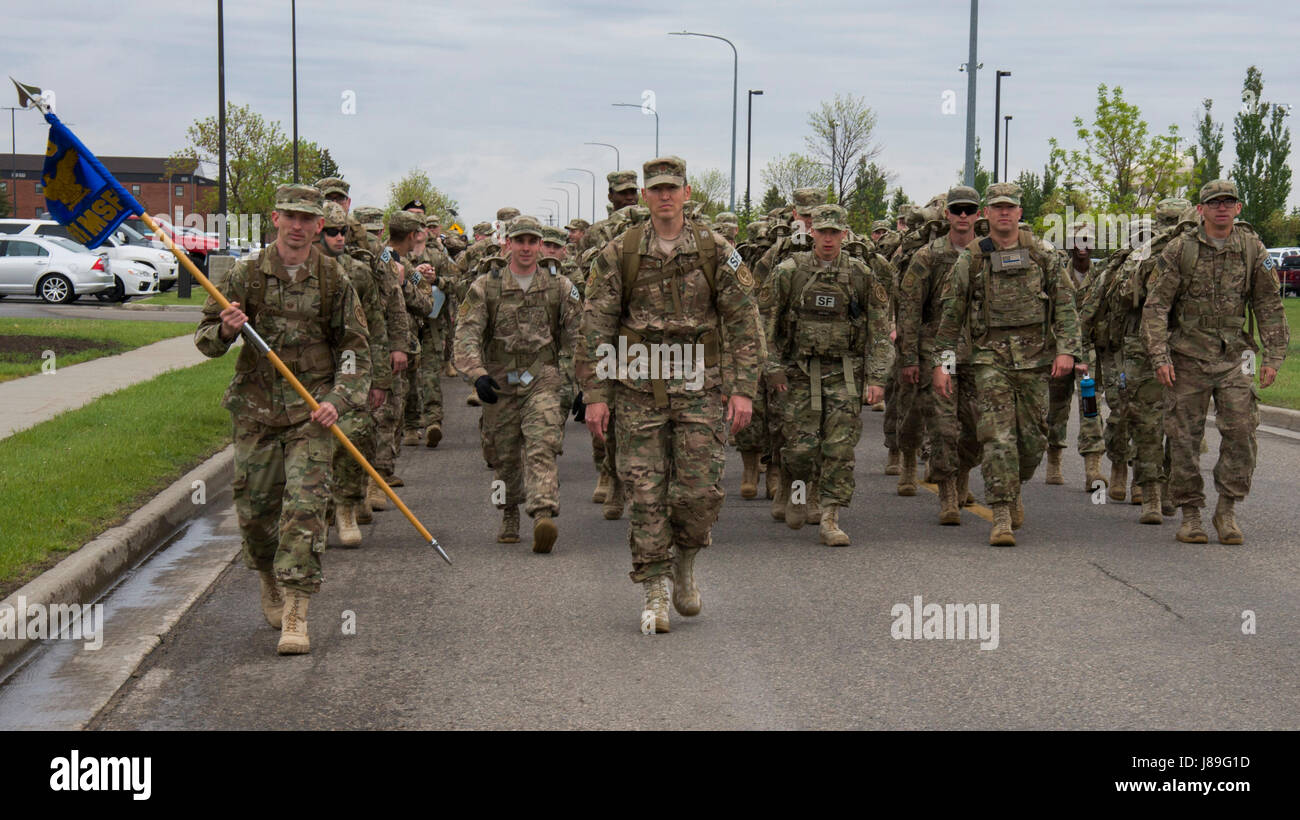 Airmen with the 91st Security Forces Group begin a 5K Remembrance Ruck ...