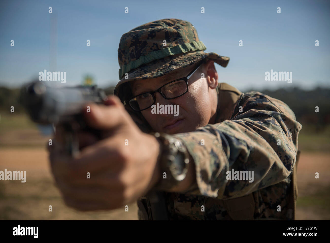 Sgt. Damian Knight practices quickly drawing his M9A1 service pistol ...
