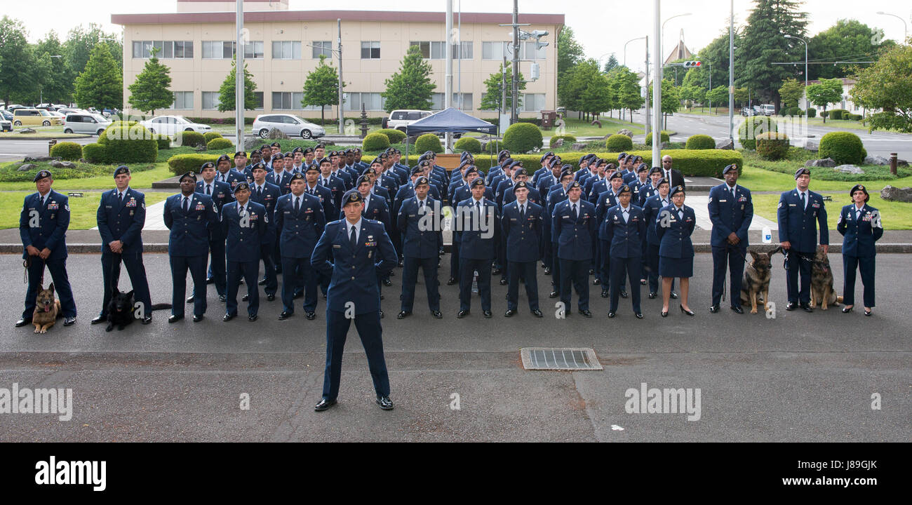 Airmen assigned to the 374th Security Forces Squadron pose for group ...