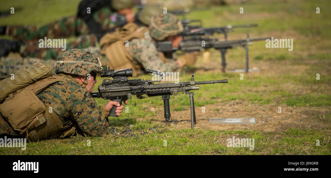 Lance Cpl. John Rudolph fires a quick burst on an M249 squad automatic ...