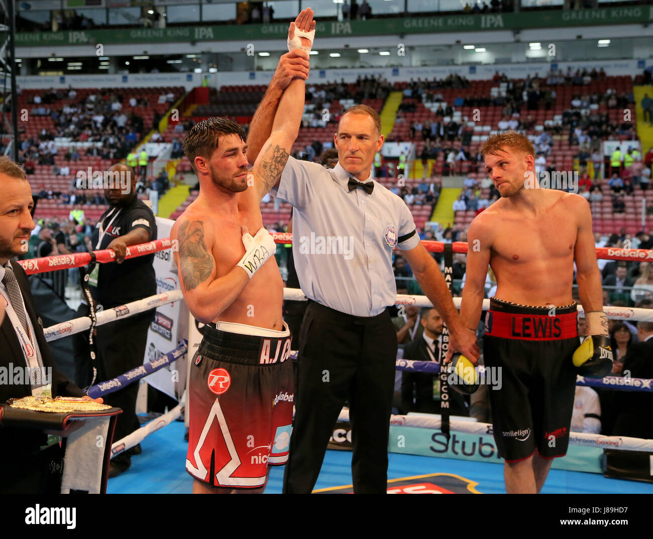 Jamie Cox (left) celebrates beating Lewis Taylor during their WBA ...