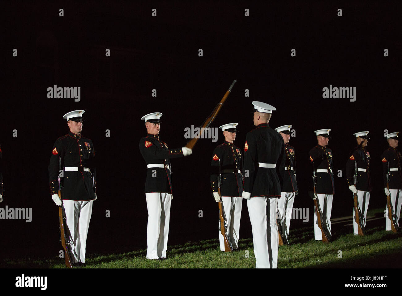 The Marine Corps Silent Drill Platoon performs during an evening parade ...