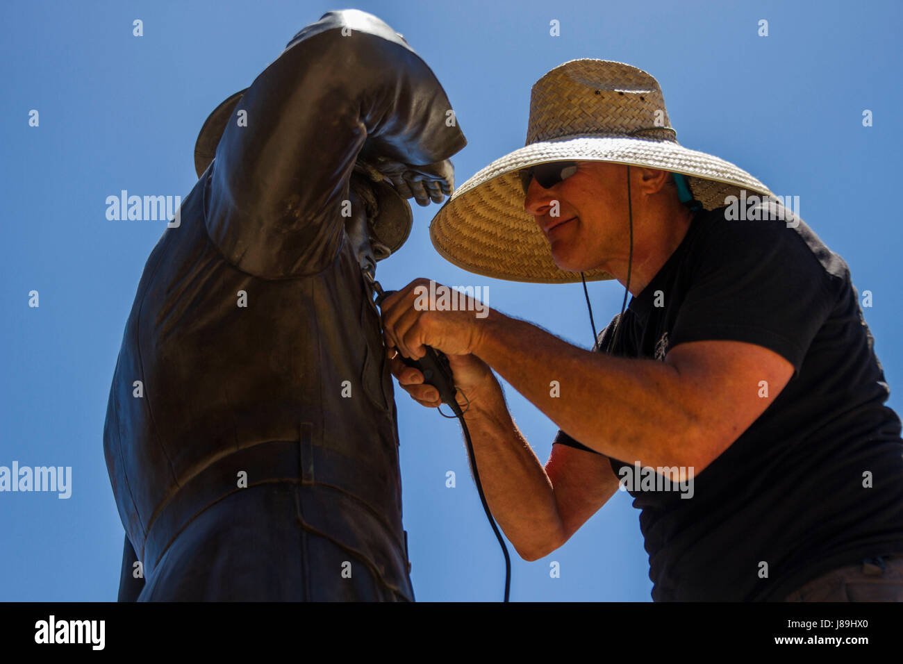 Mr. Barry Feinman using a rotary tool to detail spots will cleaning a ...