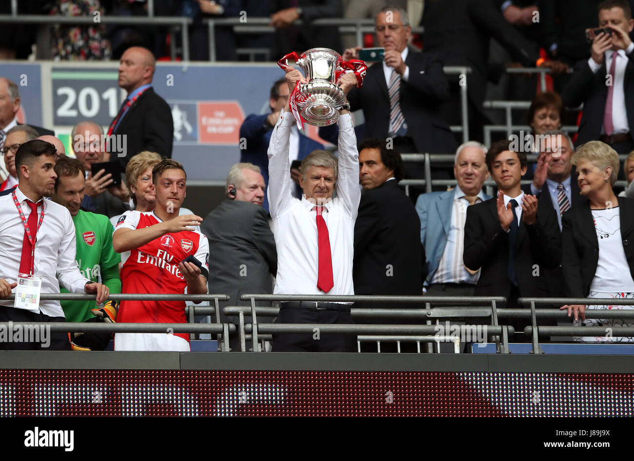 Arsenal manager Arsene Wenger lifts the FA Cup trophy after the final ...