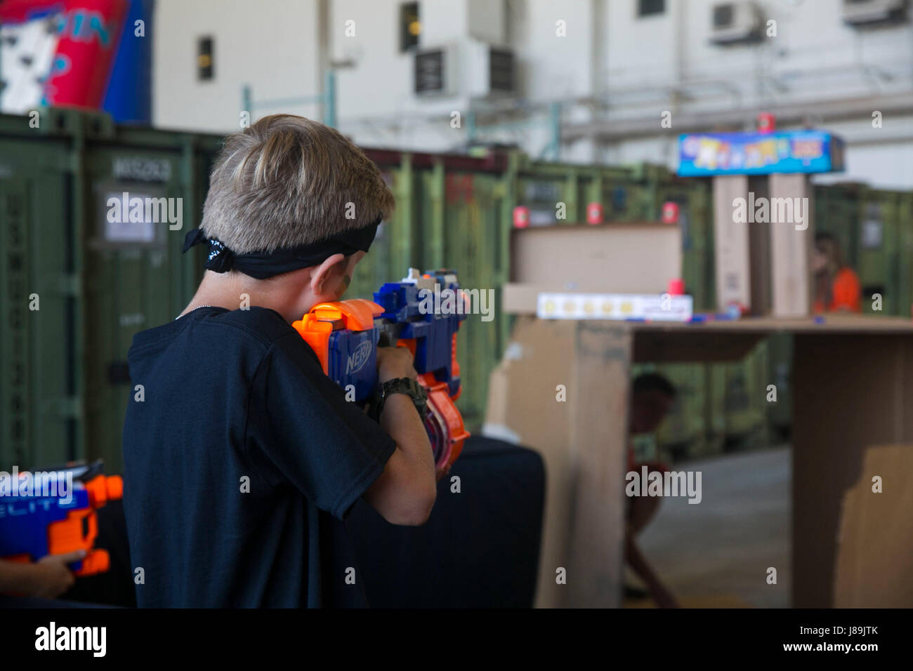 Children shoot at a range with Nerf guns at Kids Corps Day on Marine ...