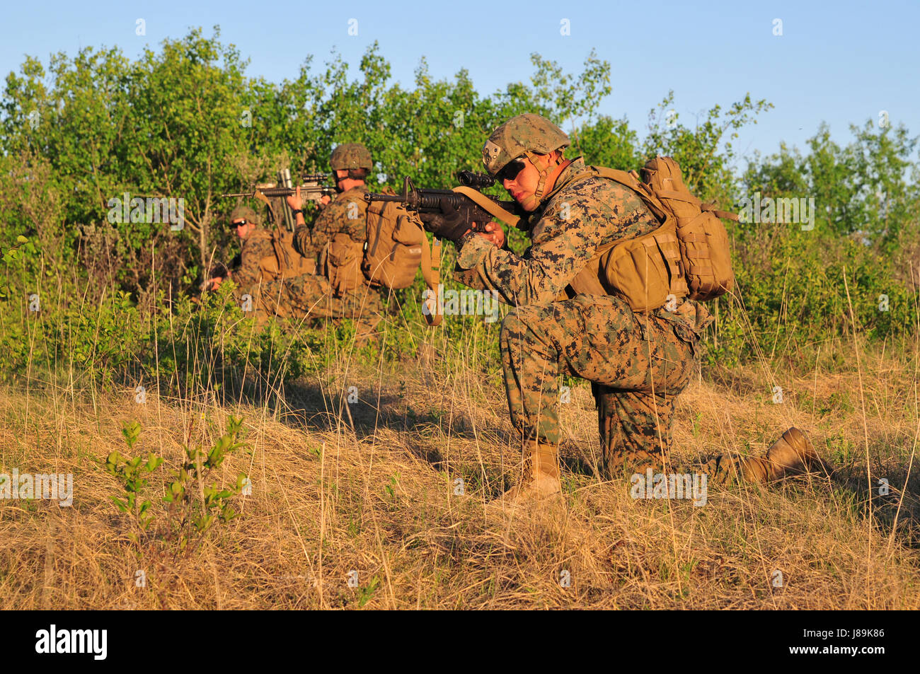 Cpl. Efren Alvarez, a fire support Marine, provides security for a ...