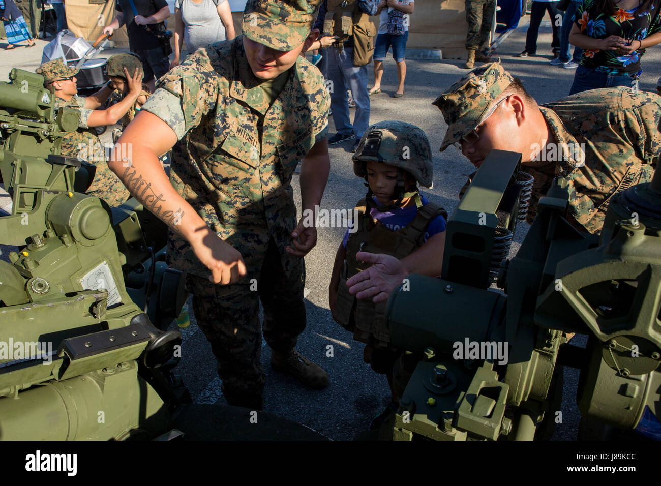 U.S. Marine Lance Cpl. Joshua Mitchell (left), an artillery cannoneer ...
