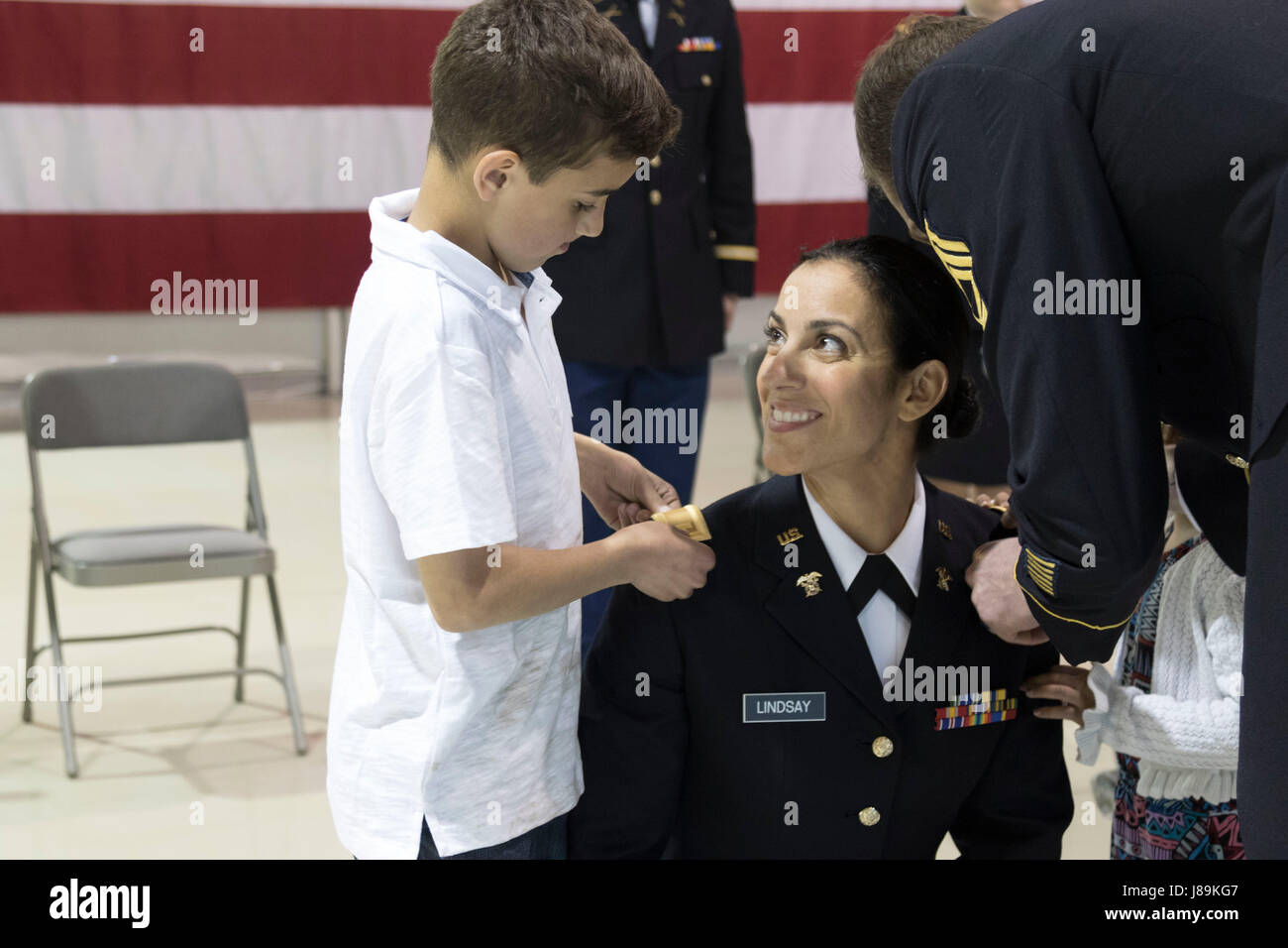 Officer Candidate Marisa Lindsay gets pinned by her son Liam, 10 ...