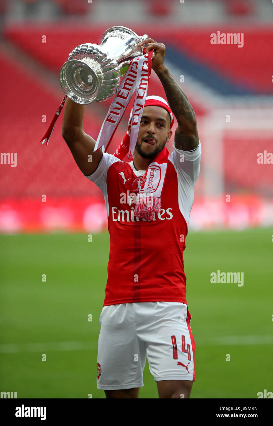 Arsenal's Theo Walcott celebrates with the FA Cup trophy after the ...